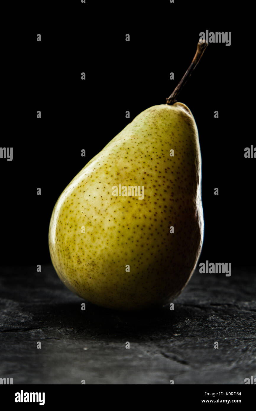 Pear on dark background Stock Photo - Alamy