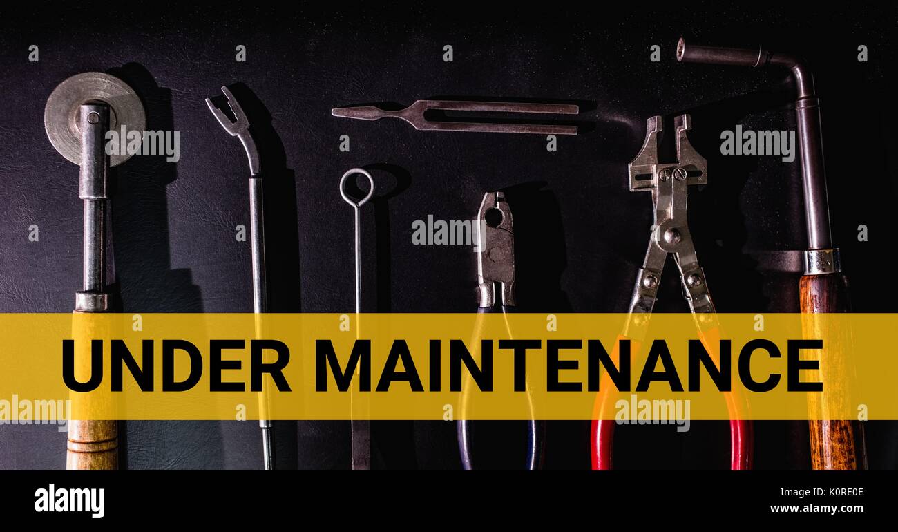 Digital composite of Under maintenance text against tools photo Stock ...