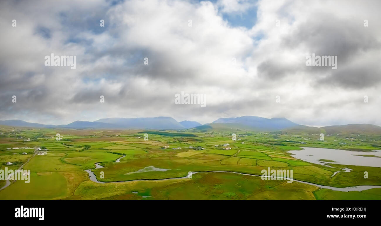 Calm view of green landscape against sky Stock Photo - Alamy