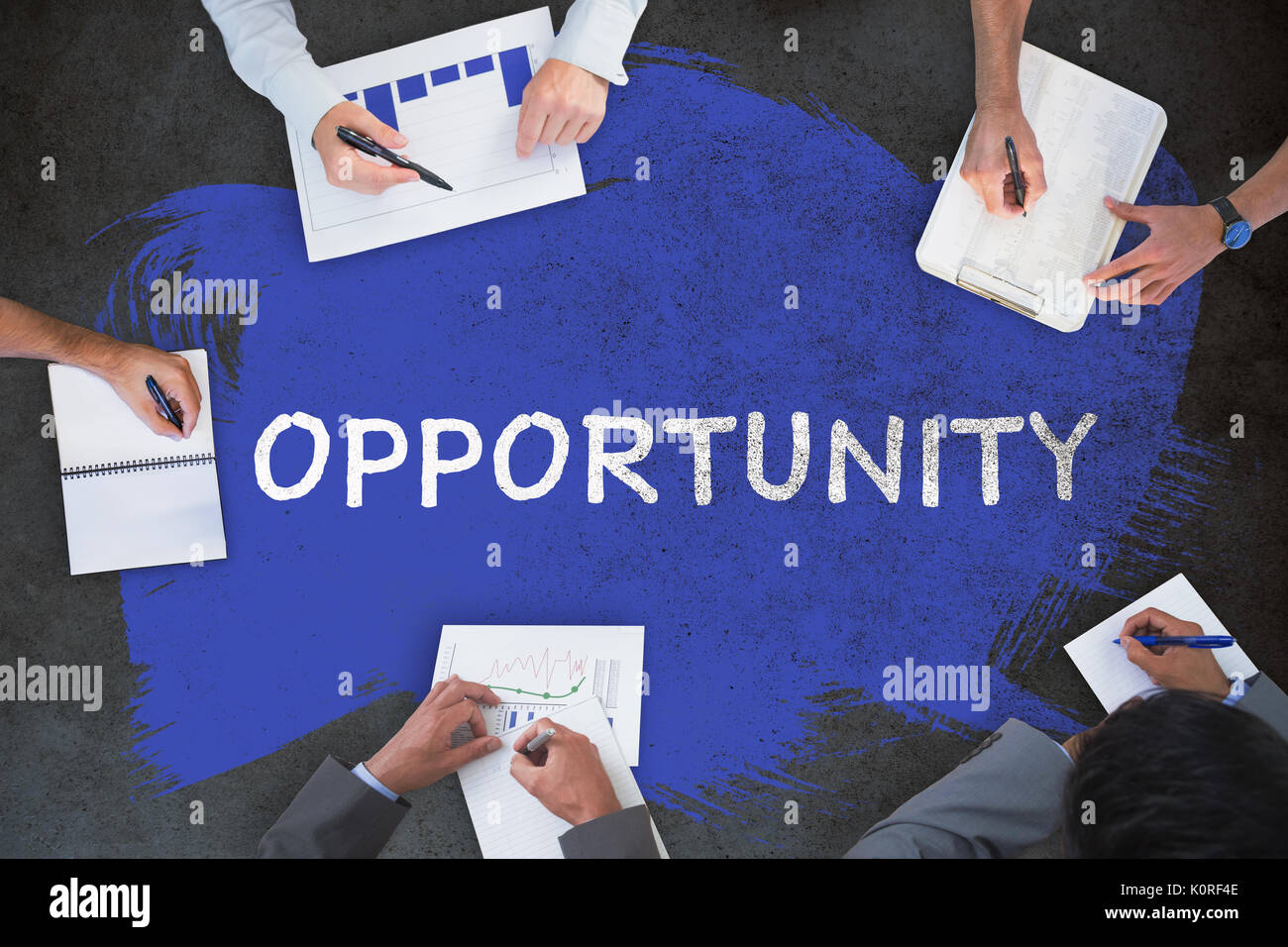 Business meeting against close-up of blackboard Stock Photo - Alamy