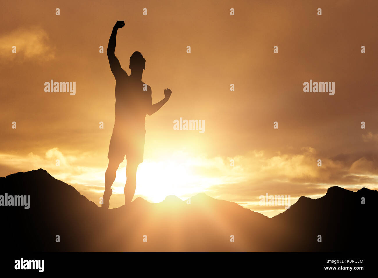 Male athlete posing after victory against cloudy sky landscape Stock ...