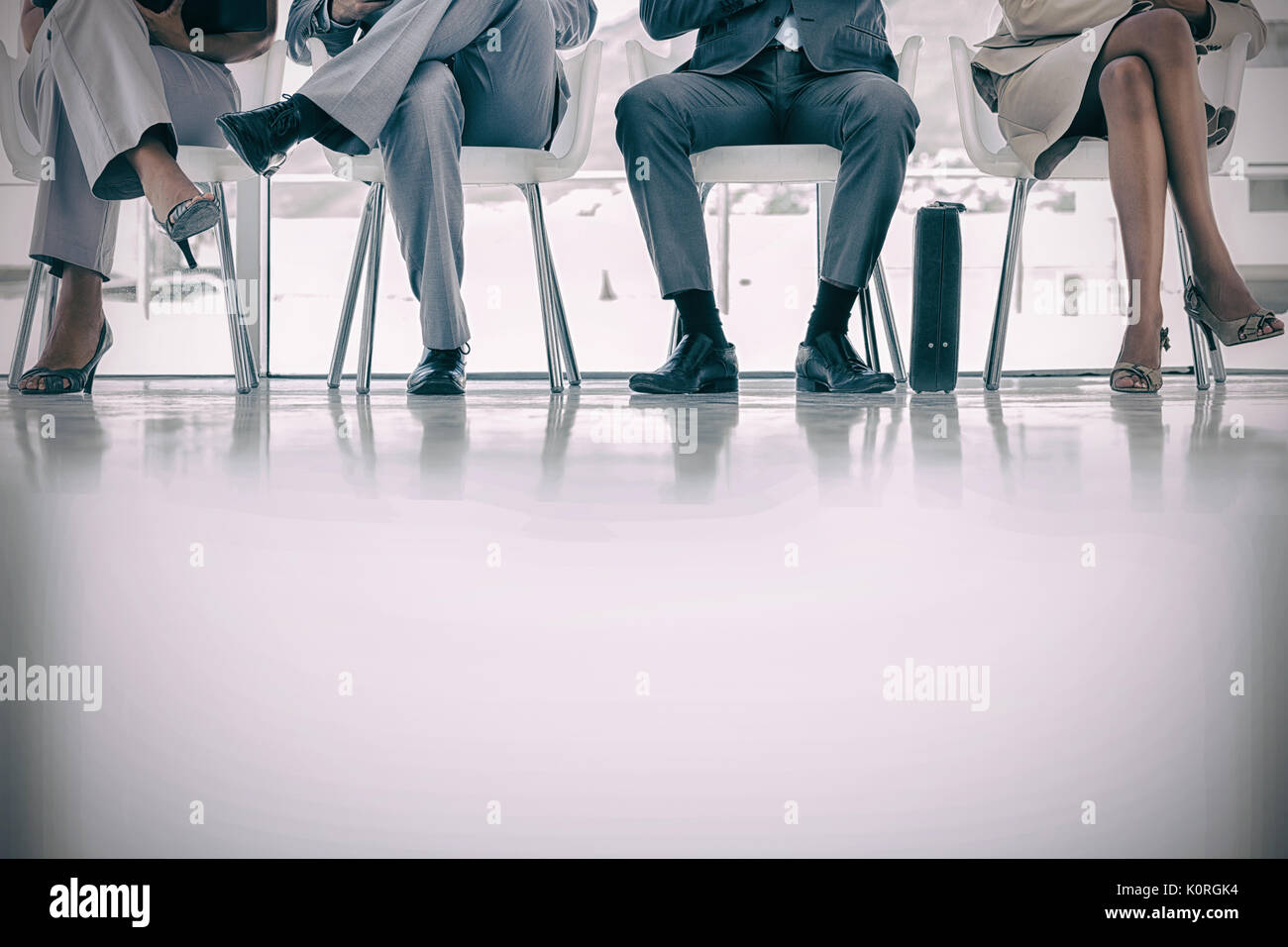 Waiting room with business people sitting in line at corridor Stock ...