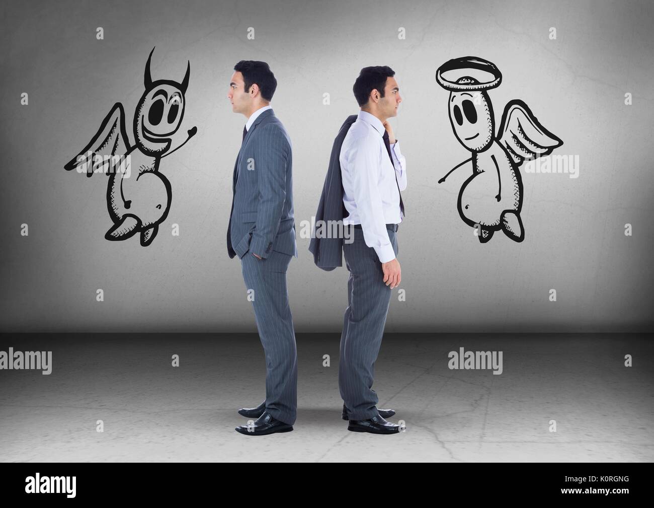 Digital composite of Good and evil graphics with Businessman looking in ...