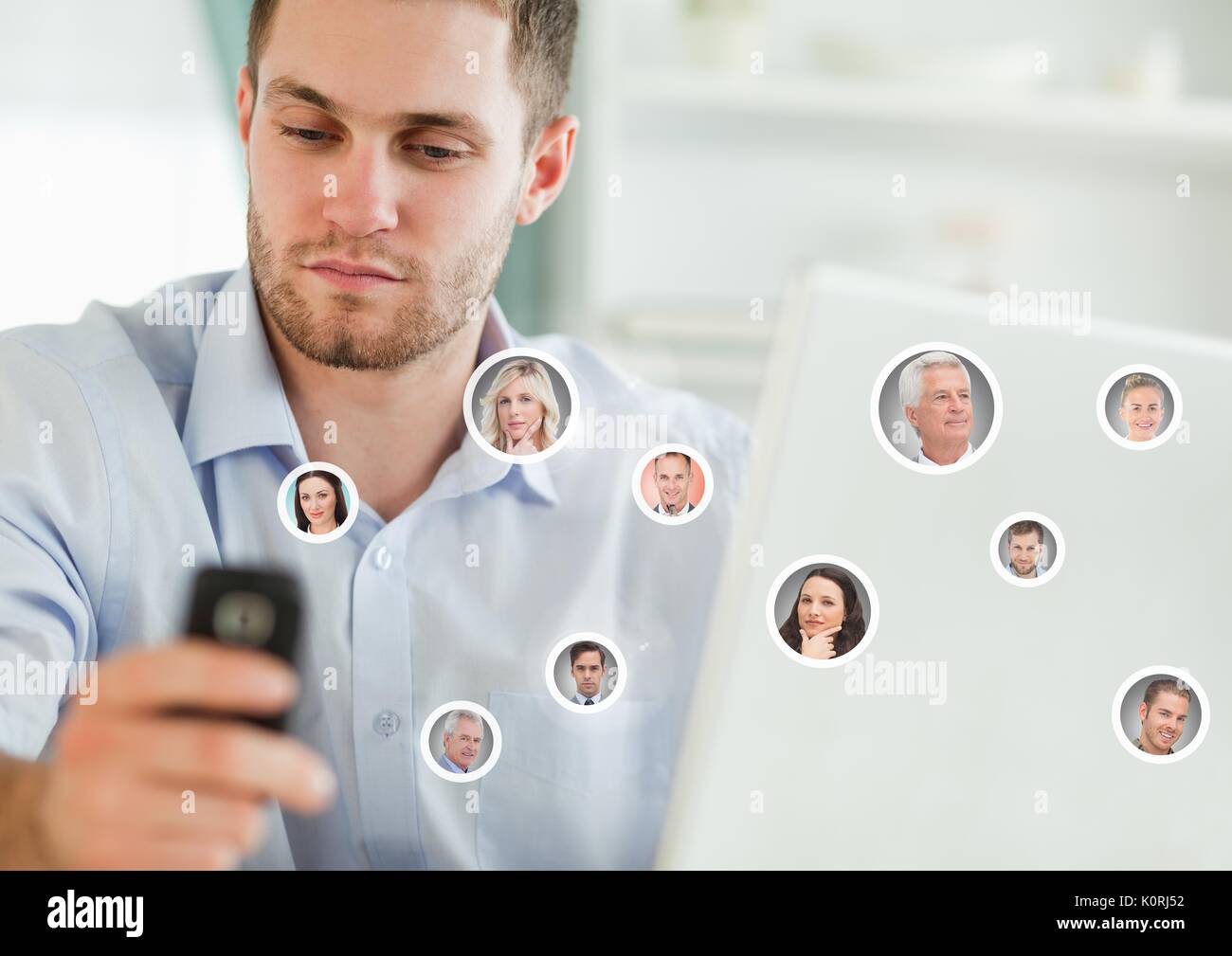 Digital composite of Man holding phone with Profile portraits of people ...