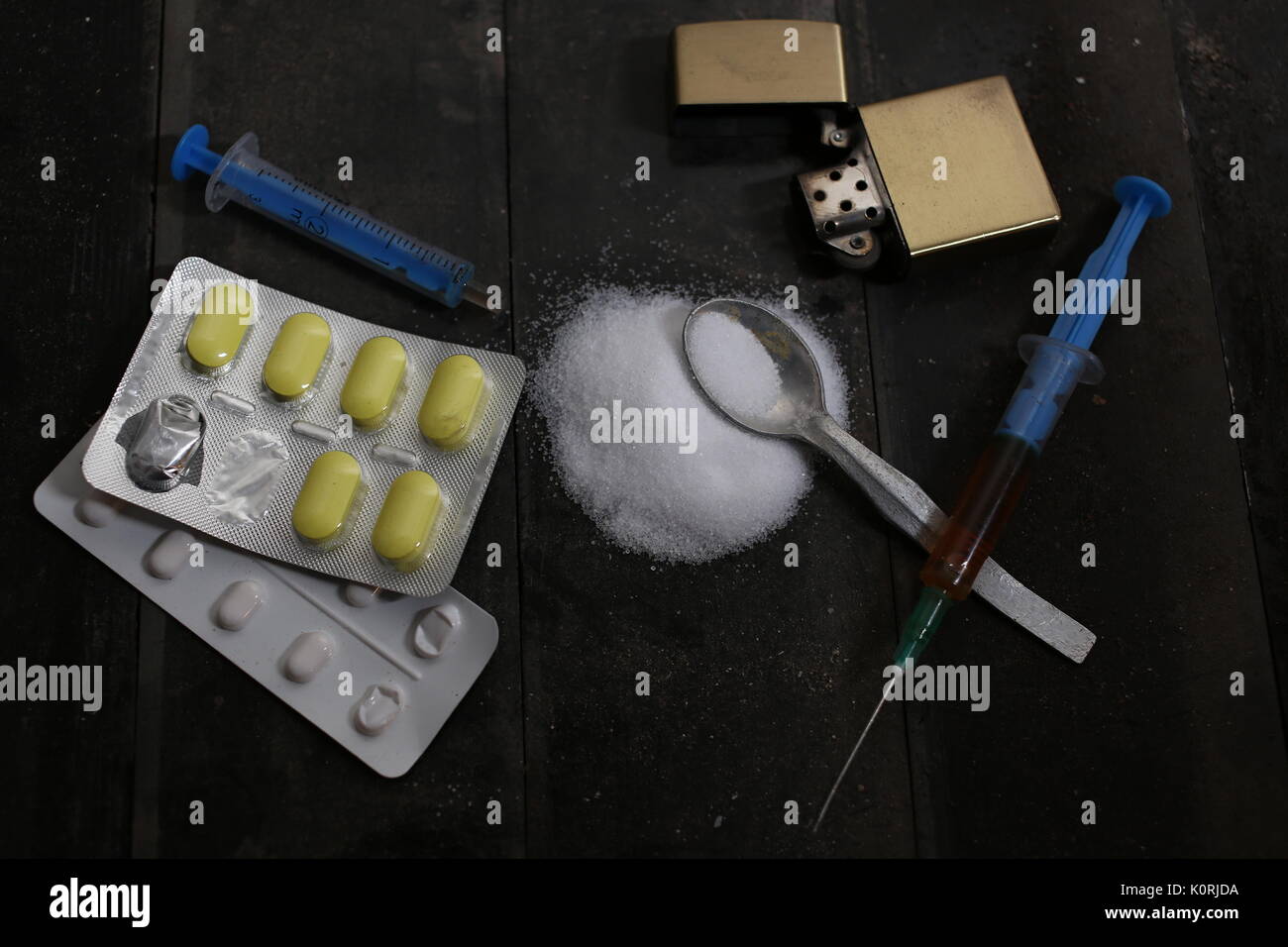 Hard drugs on dark table. A dark theme, drug use. Preparation of drugs ...