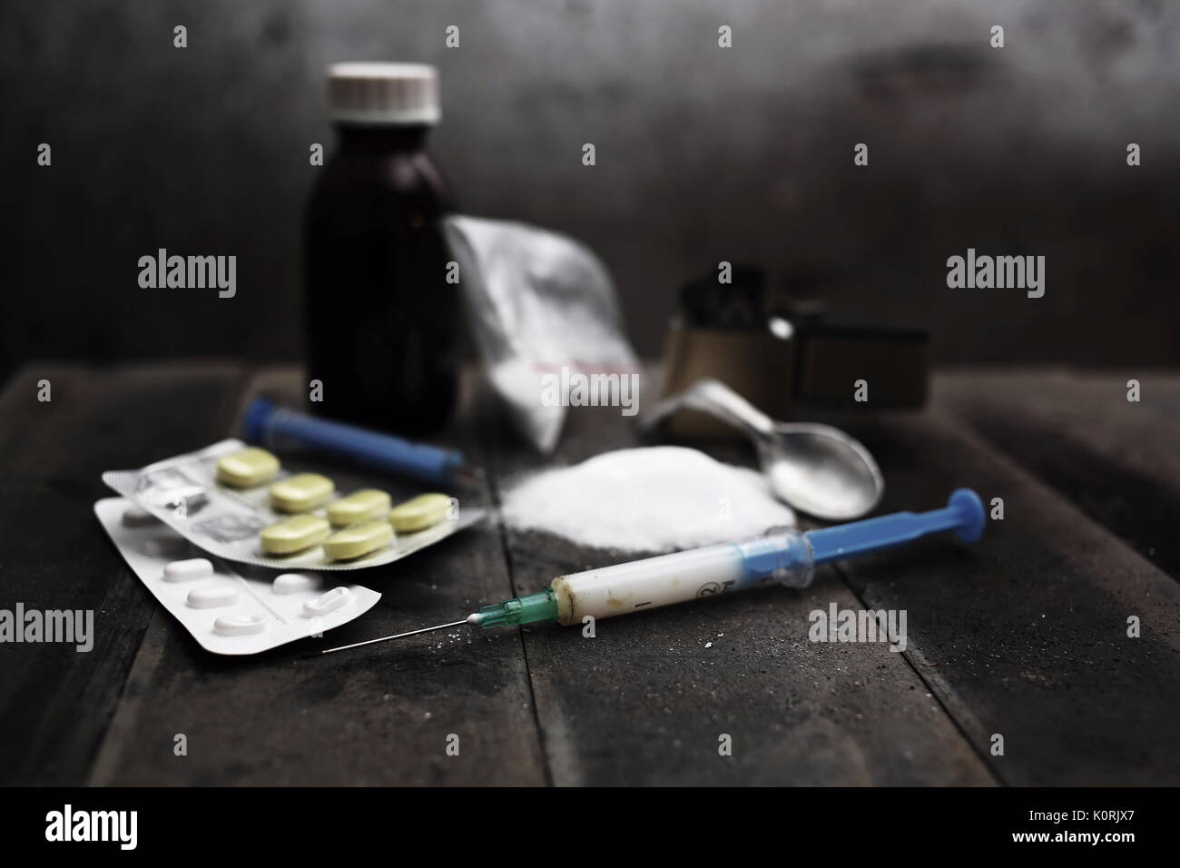 Hard drugs on dark table. A dark theme, drug use. Preparation of drugs ...