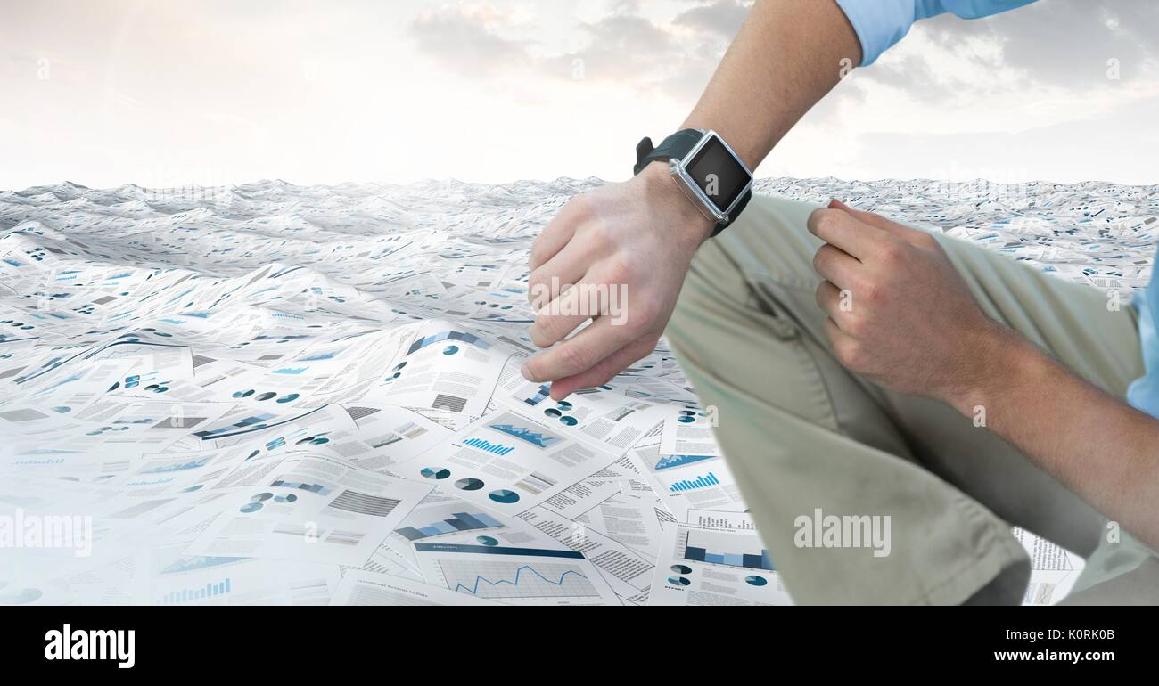 Digital composite of Businessman in sea of documents under sky clouds ...