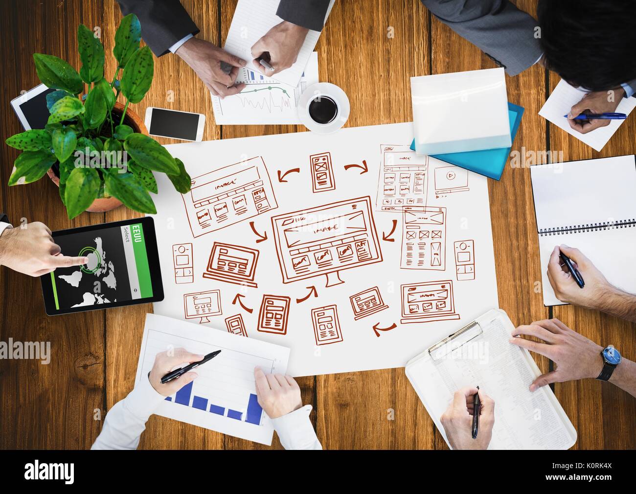 Digital composite of Table top meeting with web graphics Stock Photo ...