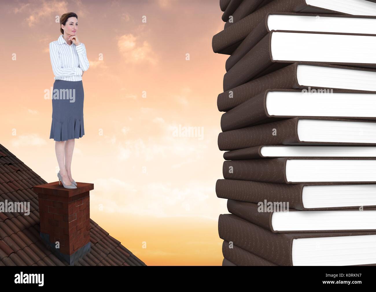 Digital composite of Woman on roof looking at 3D books Stock Photo - Alamy