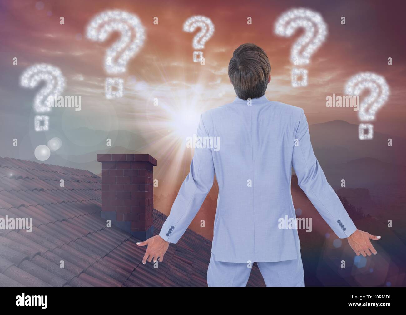 Digital composite of Question marks and Businessman standing on Roof ...