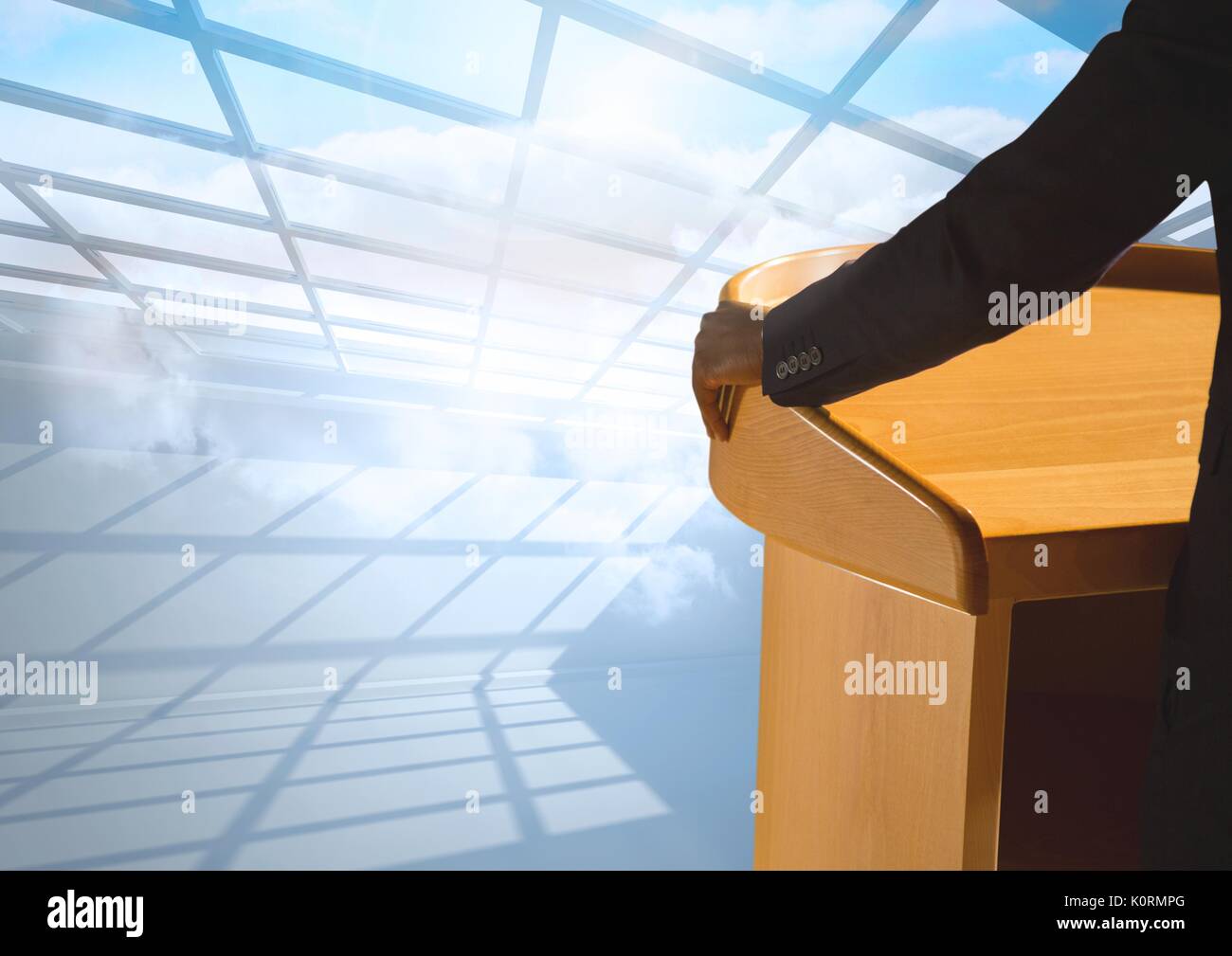 Digital composite of Businessman on podium speaking at conference with ...