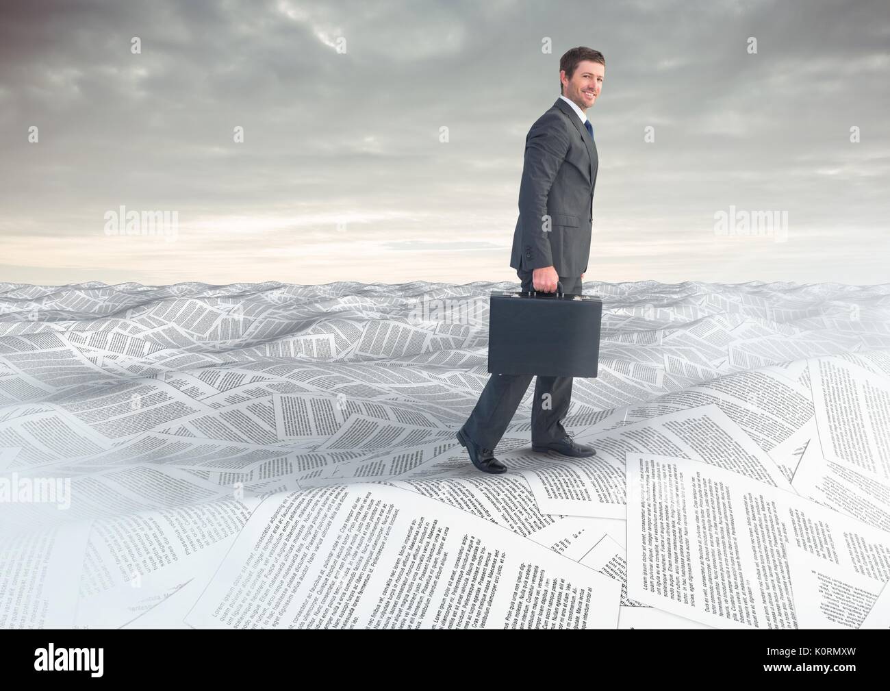 Digital composite of Businessman with briefcase in sea of documents ...