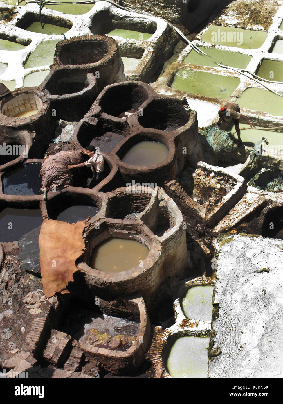 Vats ( where skins are soaked in) in the tanneries of Fes, Morocco ...