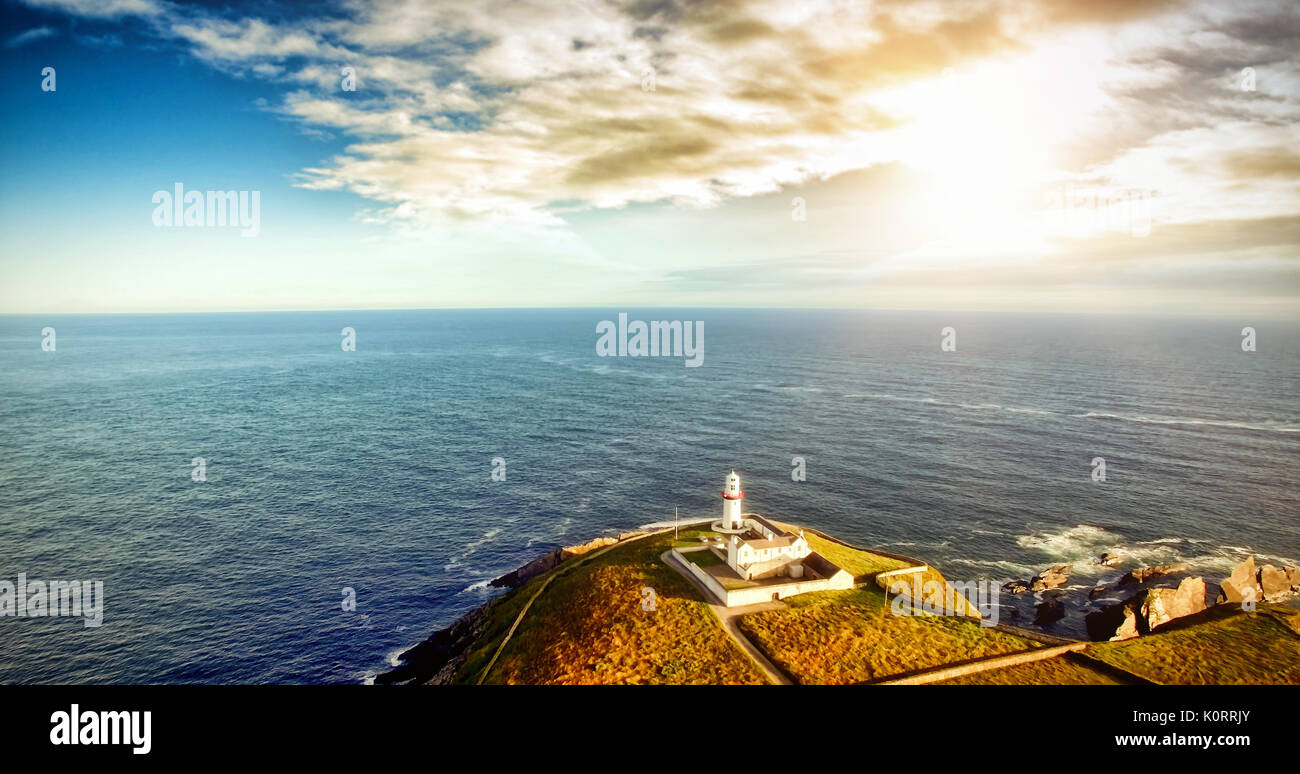 Idyllic view of sea and hill Stock Photo - Alamy