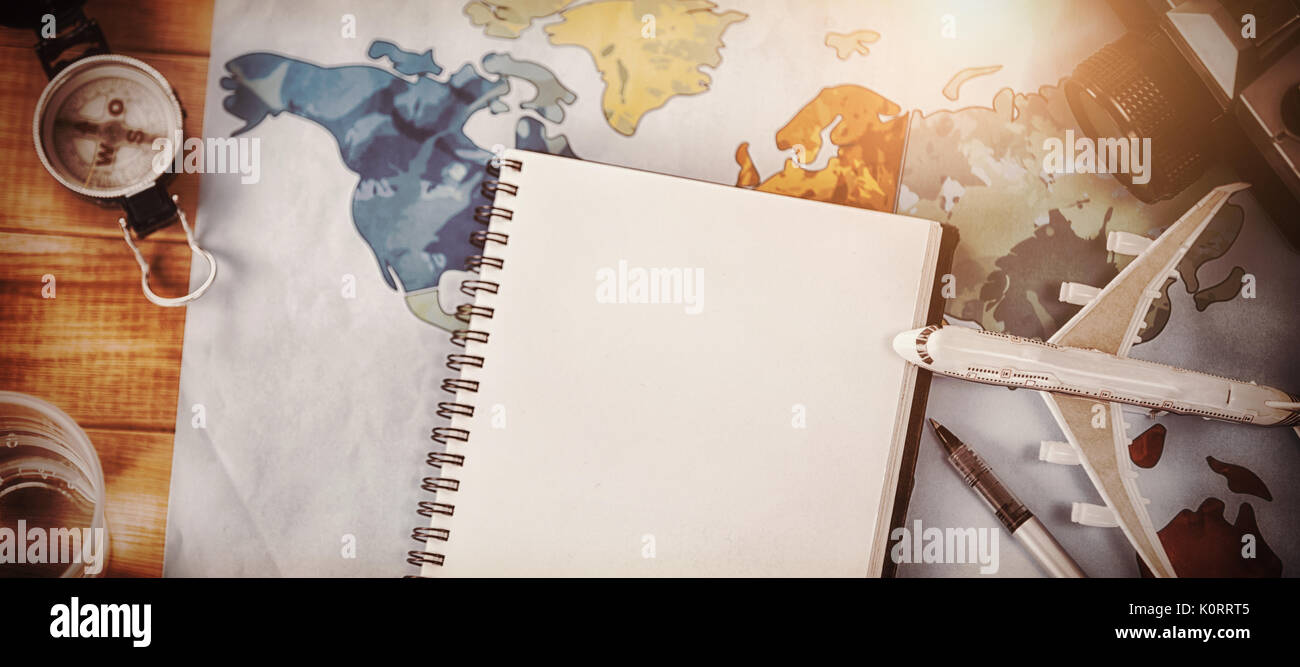 Directly above shot of diary with map and camera on table Stock Photo ...