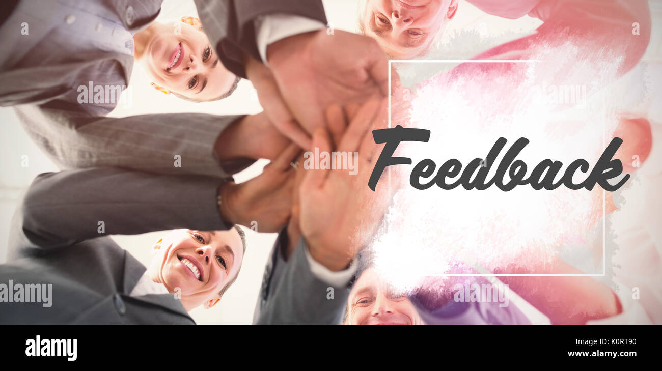 Business team standing hands together against feedback text against ...