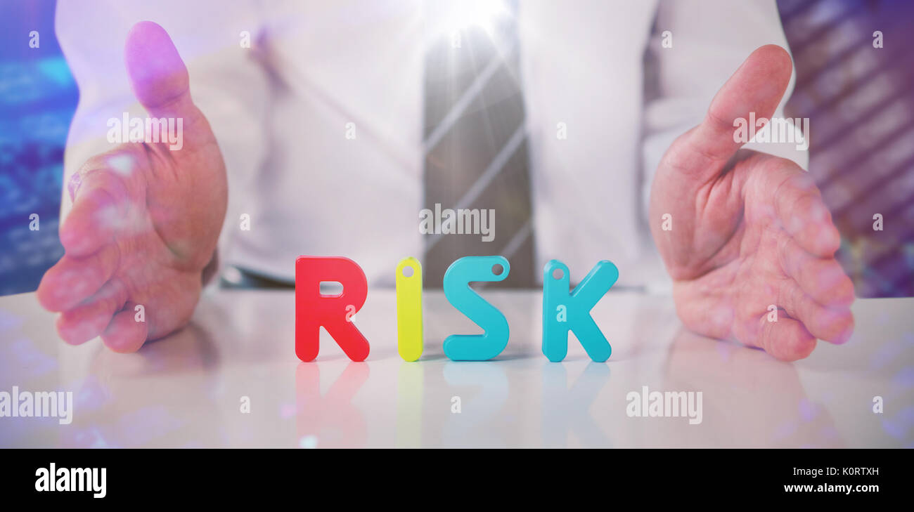 Mid section of businessman with colorful risk text against black ...