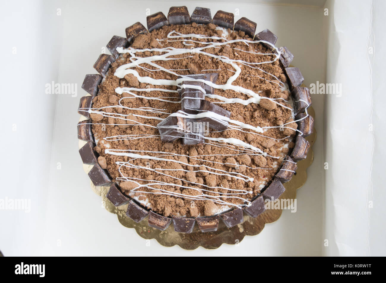 cake with powder of cocoa and bars of fondant chocolate Stock Photo - Alamy