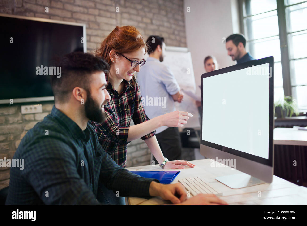 Two young successful designers hi-res stock photography and images - Alamy