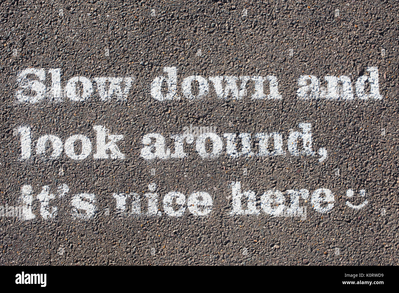 Slow down and look around its nice here stencil on a Canal towpath ...