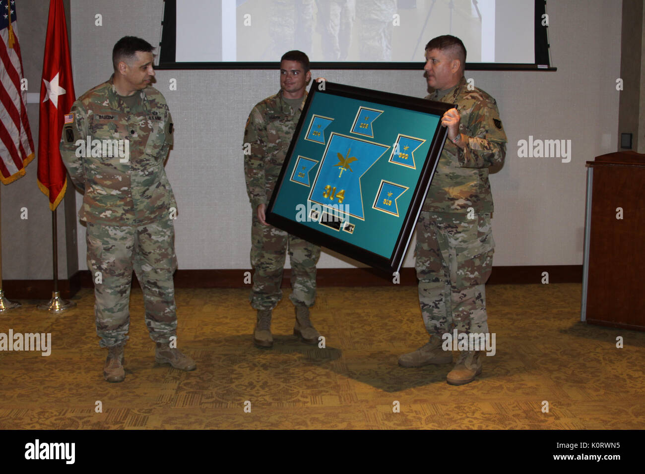 Soldiers of the 314th Press Camp Headquarters presents Lt. Col. J. Mark ...