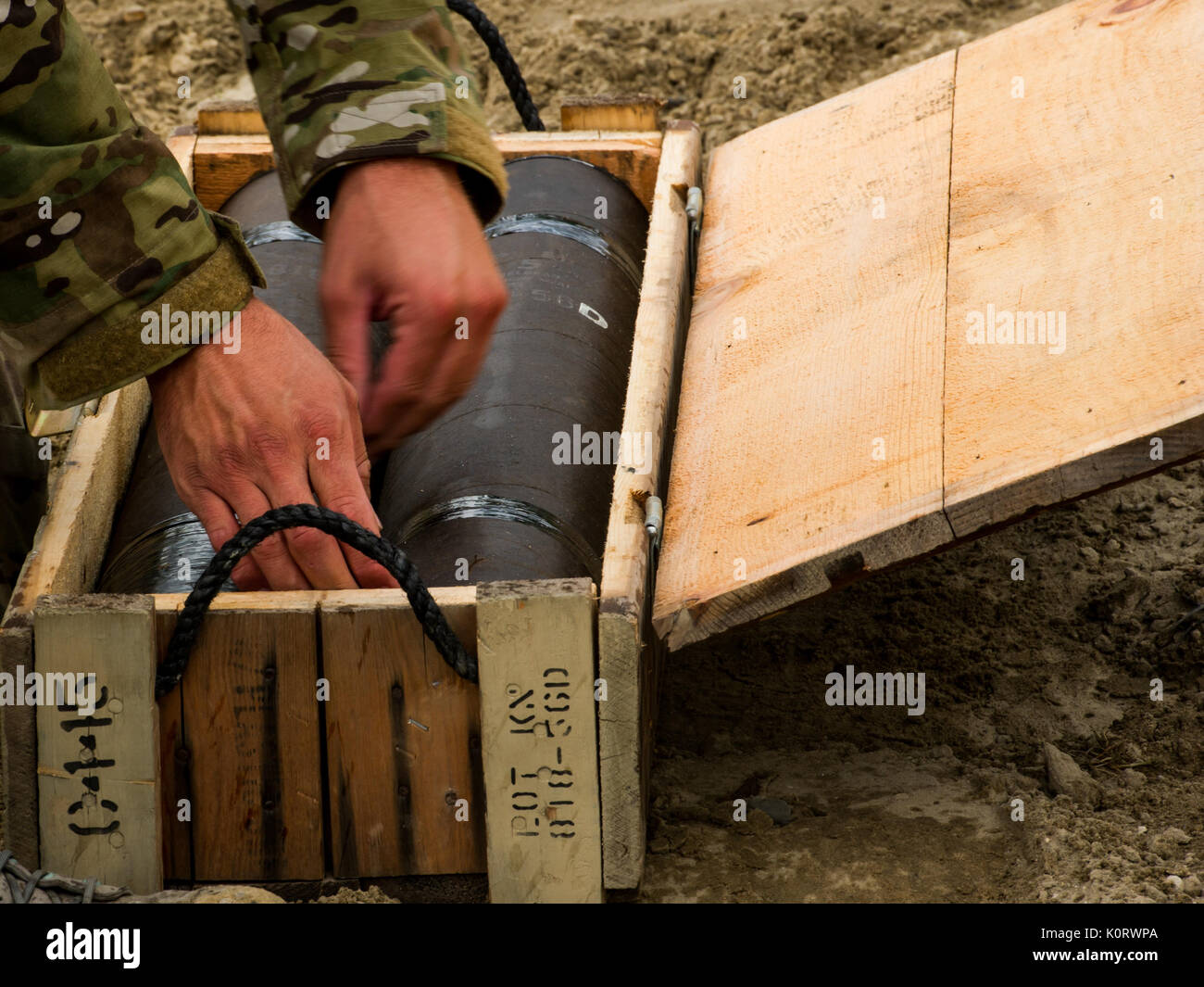 A U.S. Air Force explosive ordnance disposal technician prepares to ...