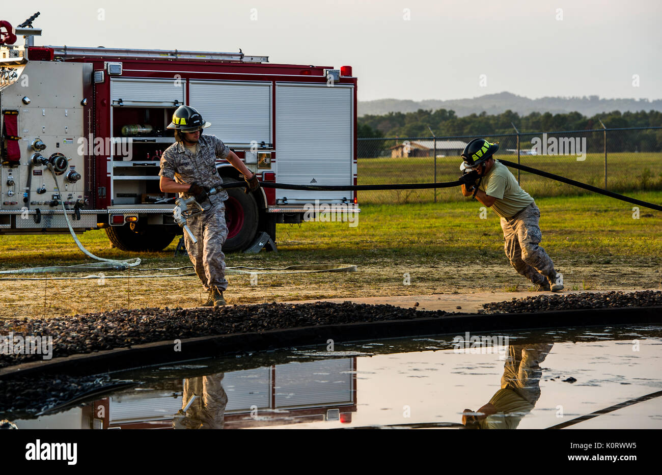 U.S. Air Force Senior Airman Dustin Lawrence, left, a firefighter with ...
