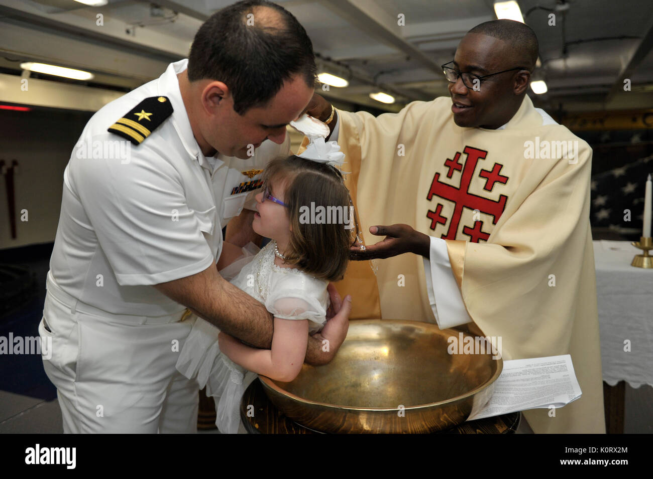 A chaplain aboard the aircraft carrier USS Gerald R. Ford (CVN 78 ...