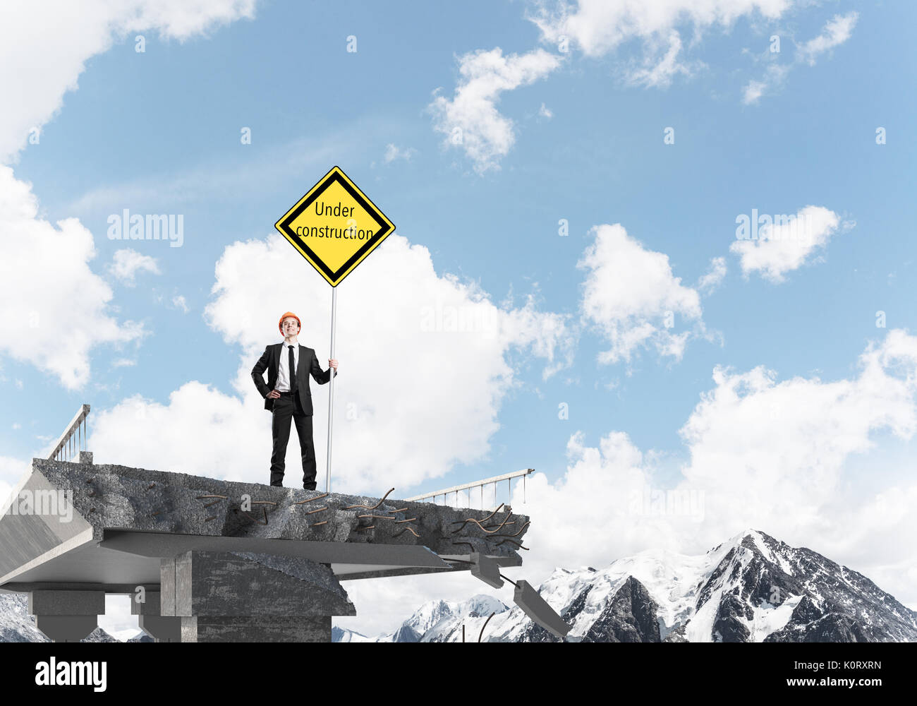Confident engineer holding street safety sign Stock Photo - Alamy