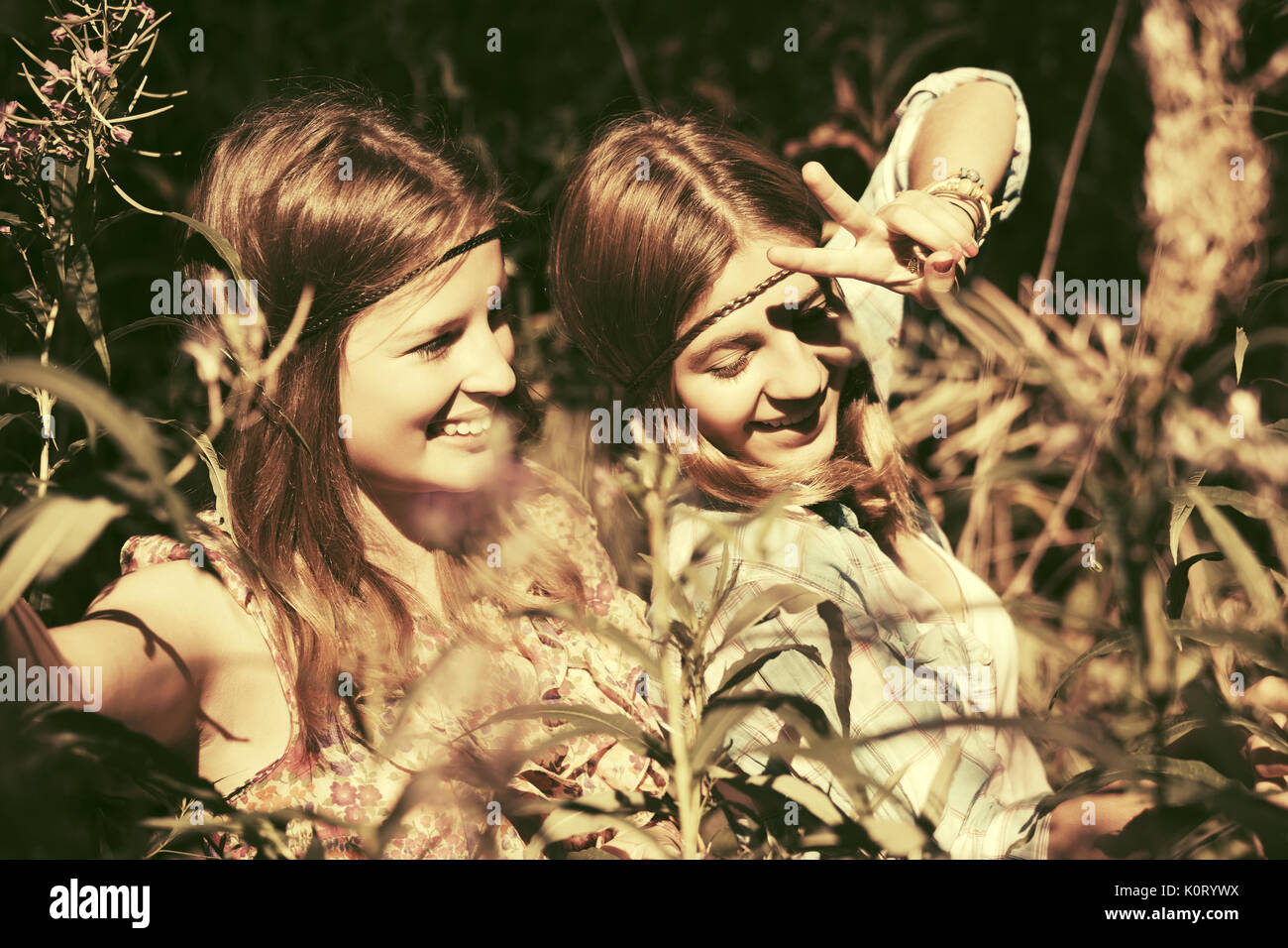 Two happy teen girls in a summer forest Stock Photo - Alamy