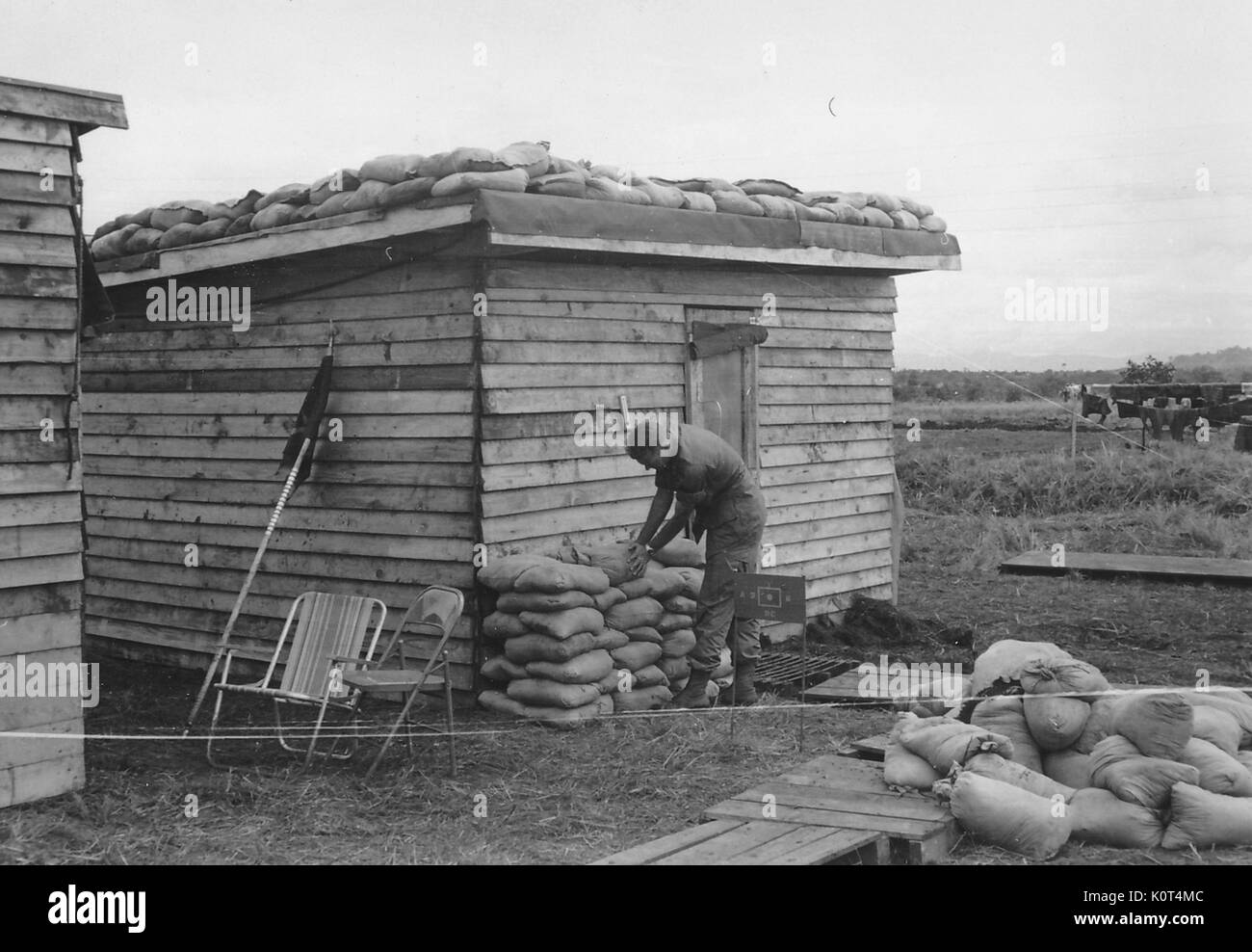Serviceman stacking sandbags hi-res stock photography and images - Alamy