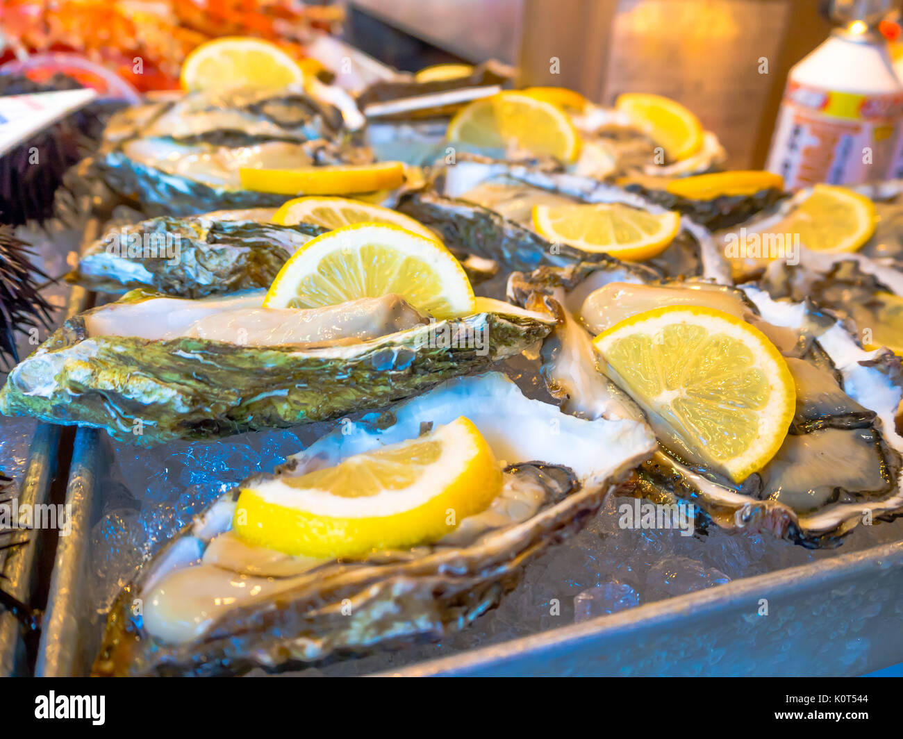 TOKYO, JAPAN JUNE 28 - 2017: Clam with a piece of lemon for sale at the ...