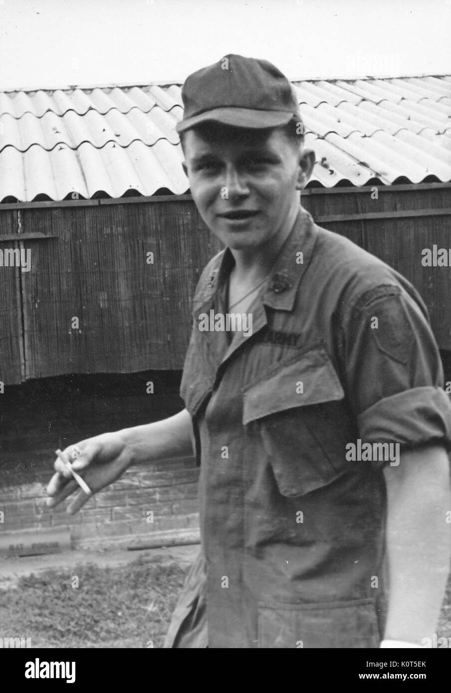 A candid photograph of a United States Army serviceman smoking a ...