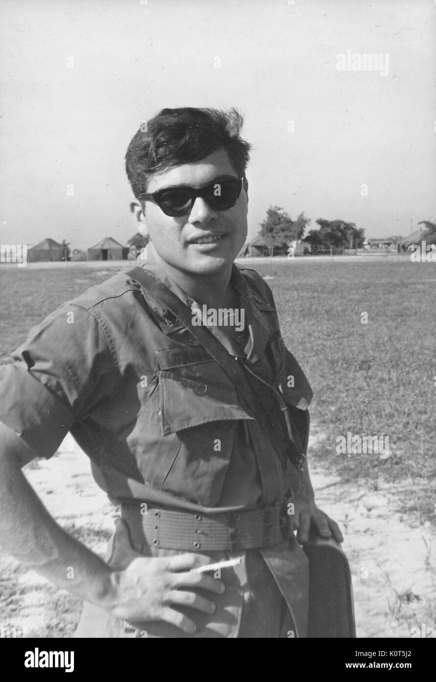 A United States Army serviceman posing with his hands on his hips, he ...