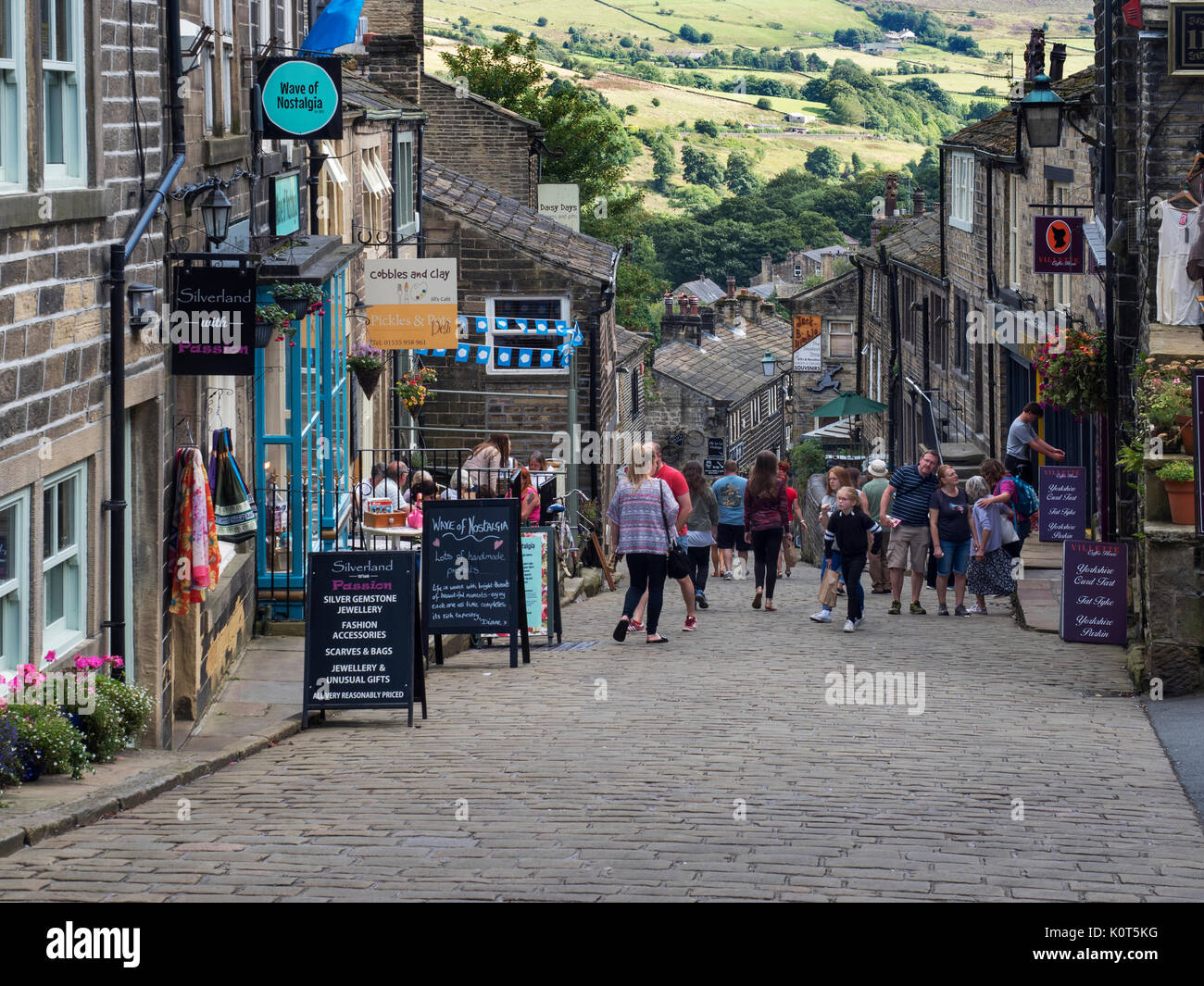 Visitors on the Hill on Main Street at Haworth West Yorkshire England ...
