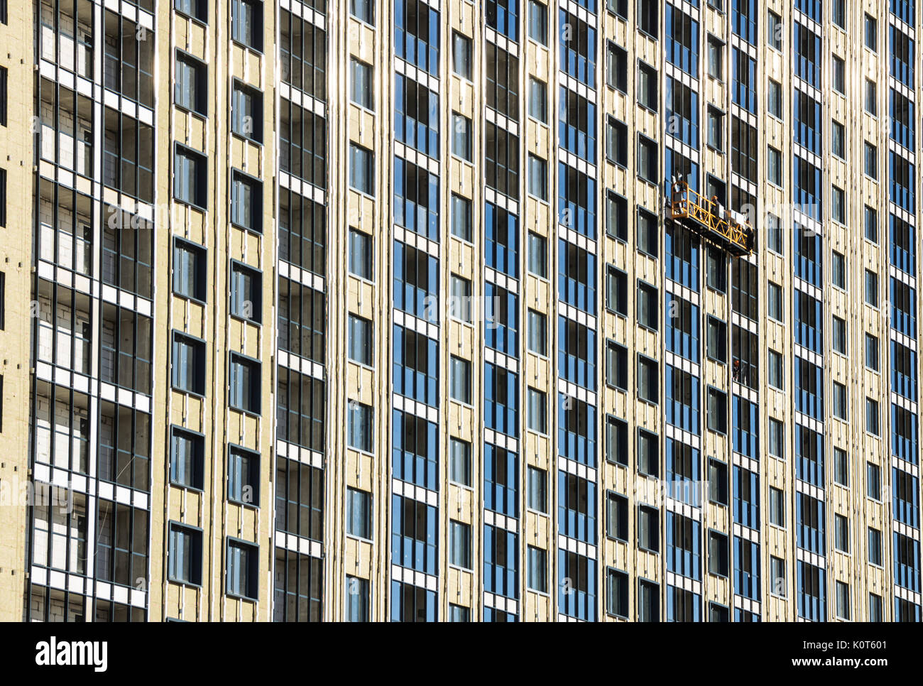 Construction decoration work of the facade by builders in a ...