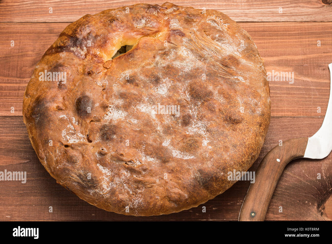 Rustic hot pie with meat and potato stuffing on the table Stock Photo ...