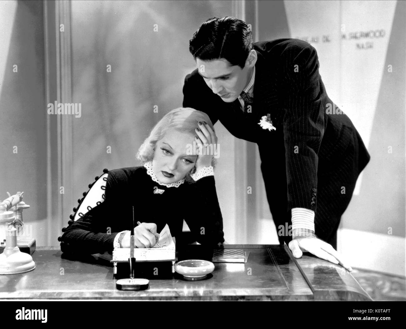 BETTE DAVIS, PHILLIP REED, FASHIONS OF 1934, 1934 Stock Photo - Alamy