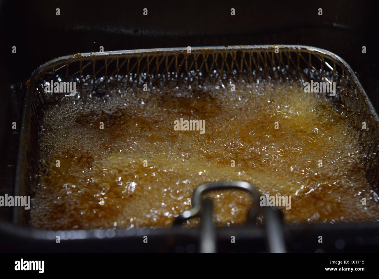 French fries cooking in a deep fryer Stock Photo - Alamy