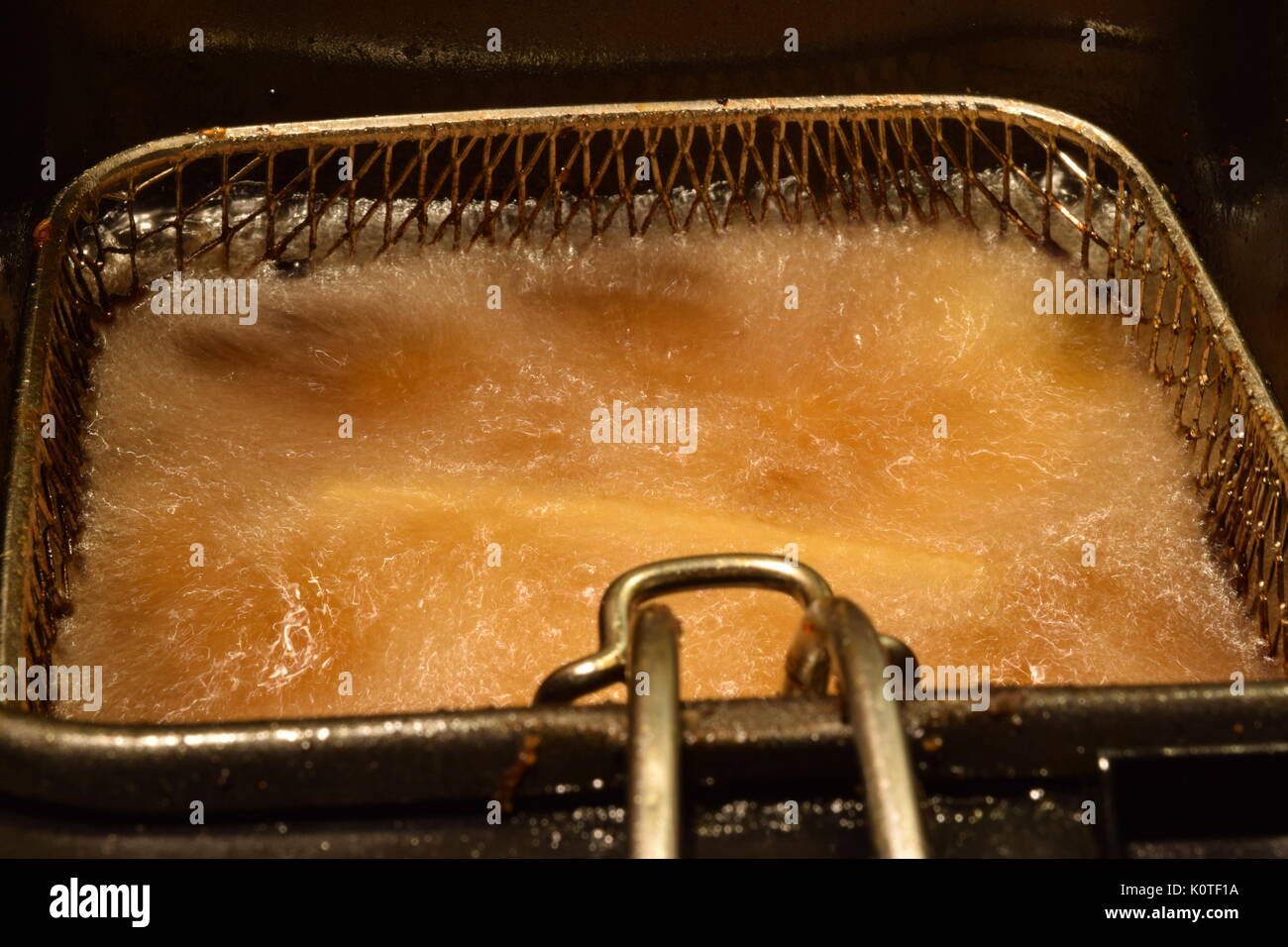 French fries cooking in a deep fryer Stock Photo - Alamy