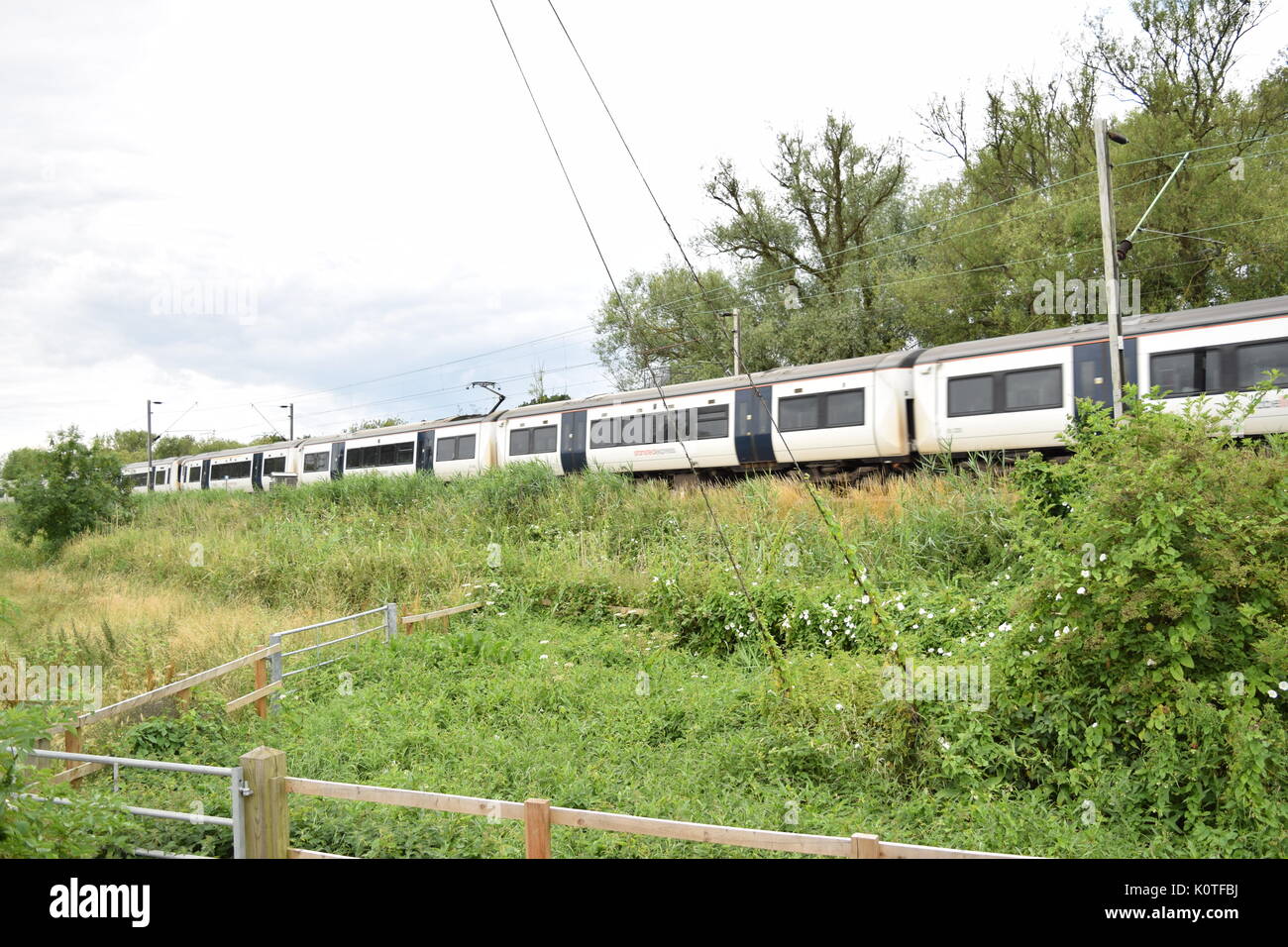 Moving train in countryside Stock Photo - Alamy