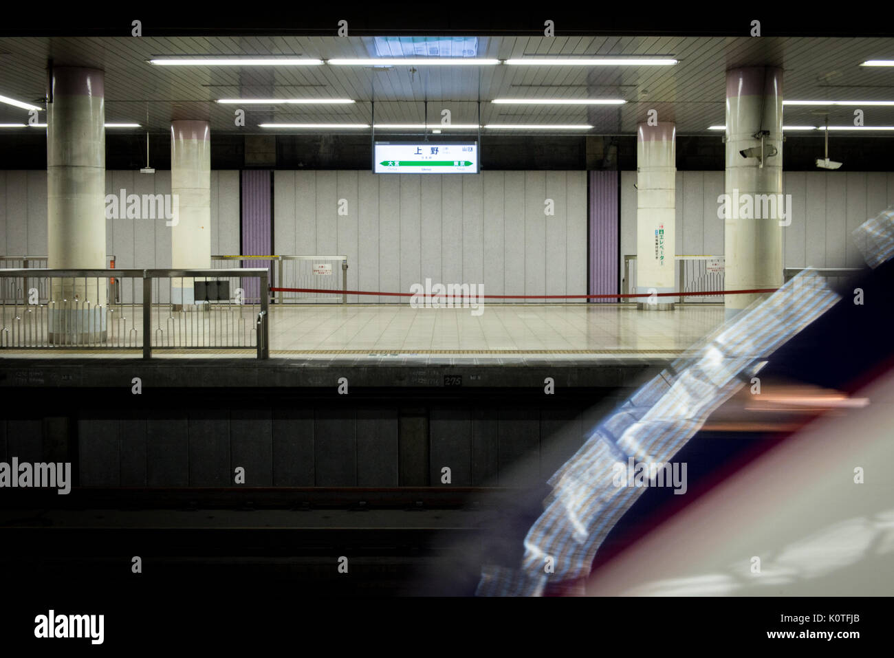 Underground train platform with train in motion Stock Photo - Alamy
