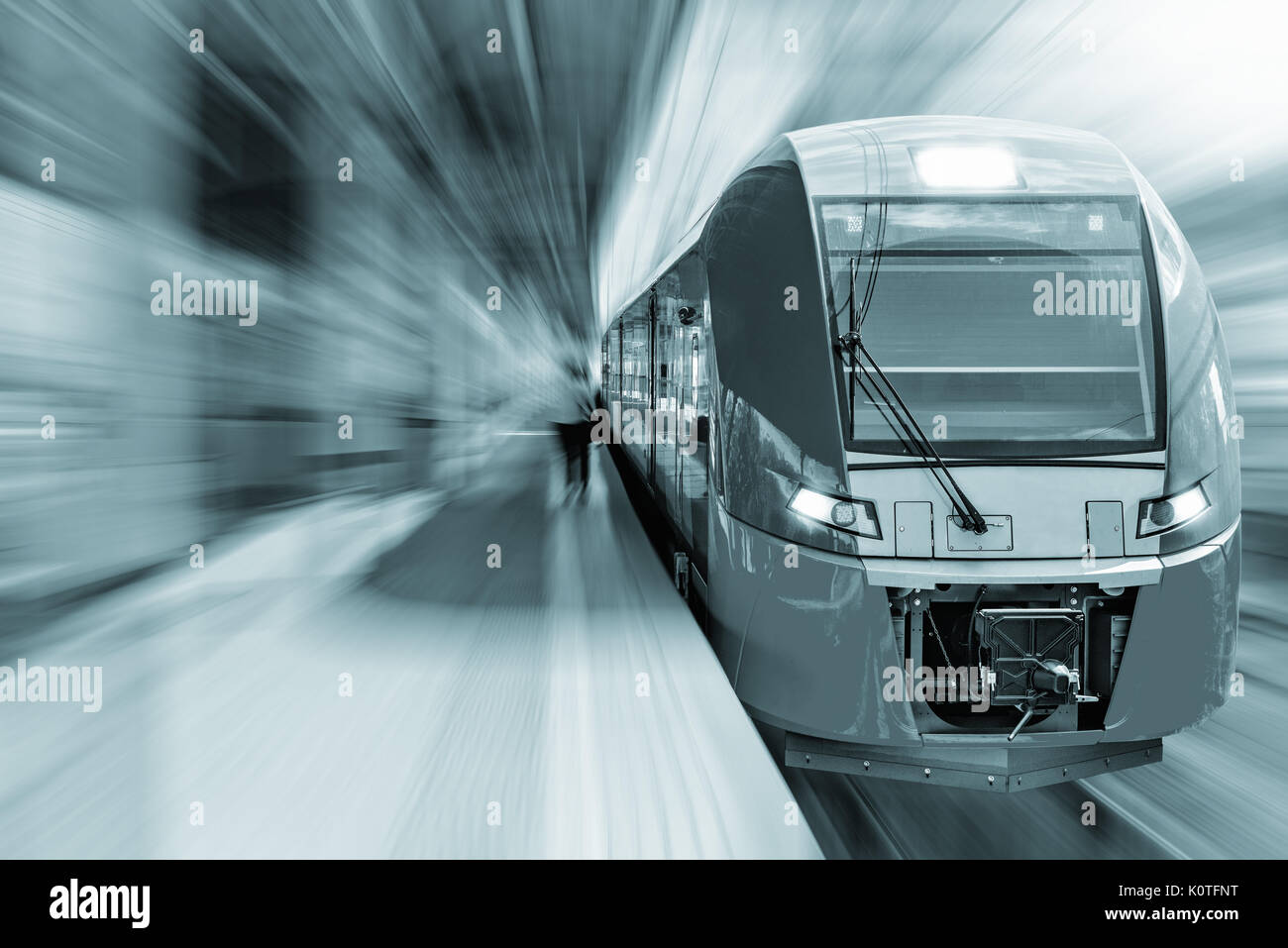 Modern high-speed train moves fast along the platform Stock Photo - Alamy