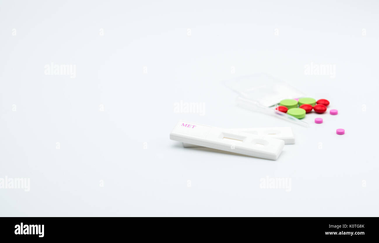 Two methamphetamine cassette test and plastic dropper with red, pink ...