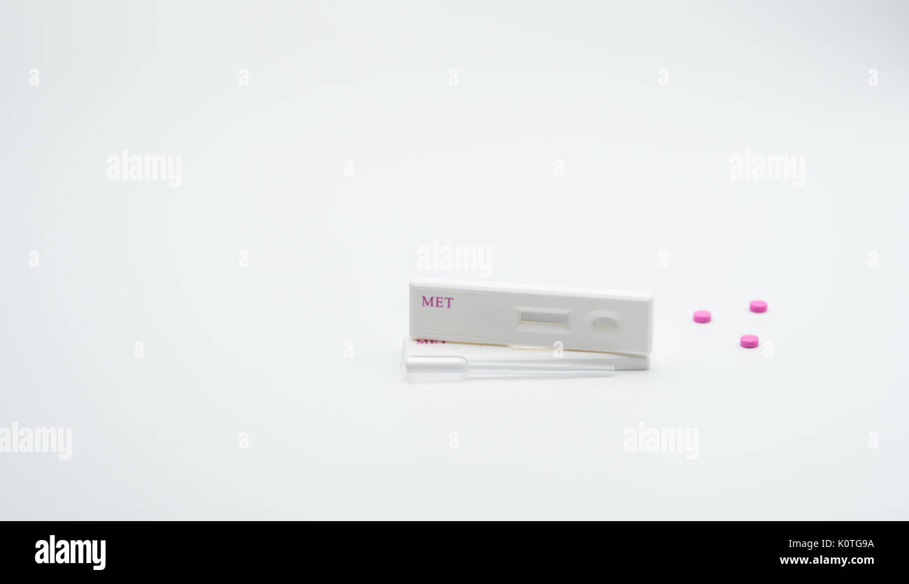 Two methamphetamine cassette test and plastic dropper with pink drugs ...