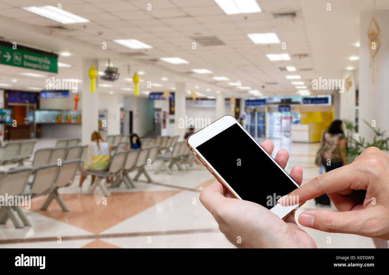 Human holding blank screen of smart phone and waiting arrivals ...