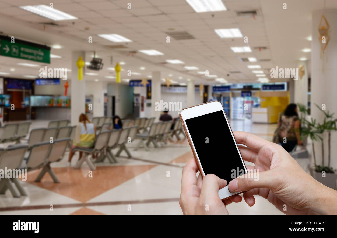 Human holding blank screen of smart phone and waiting arrivals time ...