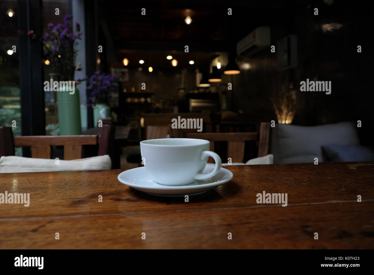 Coffee cup in coffee on table in cafe Stock Photo - Alamy