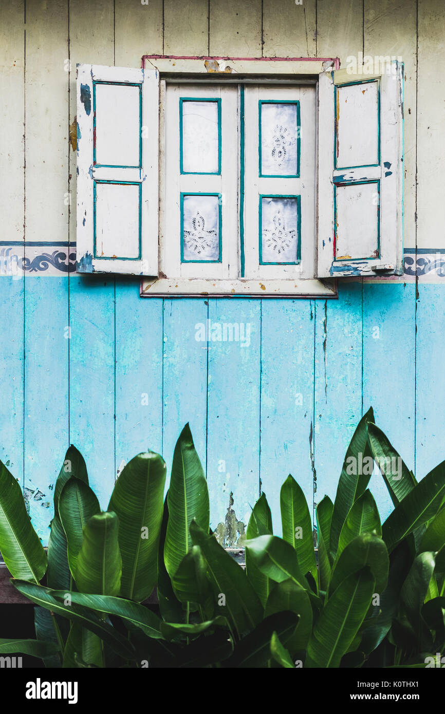 Old vintage wooden window with shutters and curtains on traditional ...