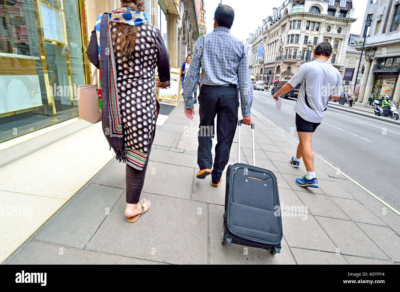 Man pulling trolley hi-res stock photography and images - Alamy